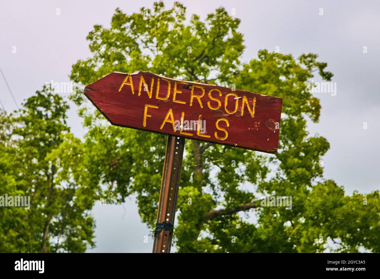 Road sign for Anderson Falls with green trees in background Stock Photo ...