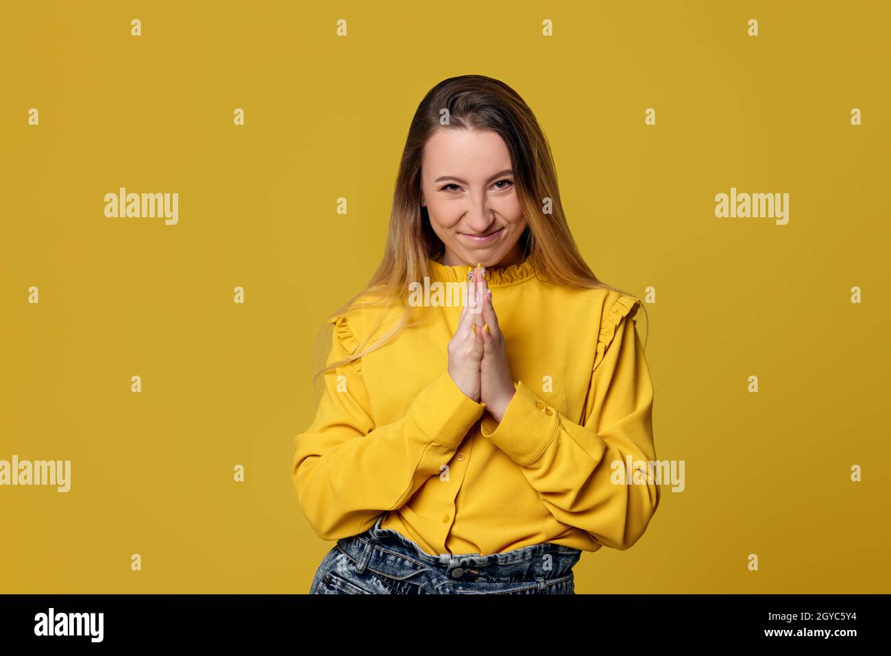 happy woman on yellow background. girl is expecting a pleasant surprise ...
