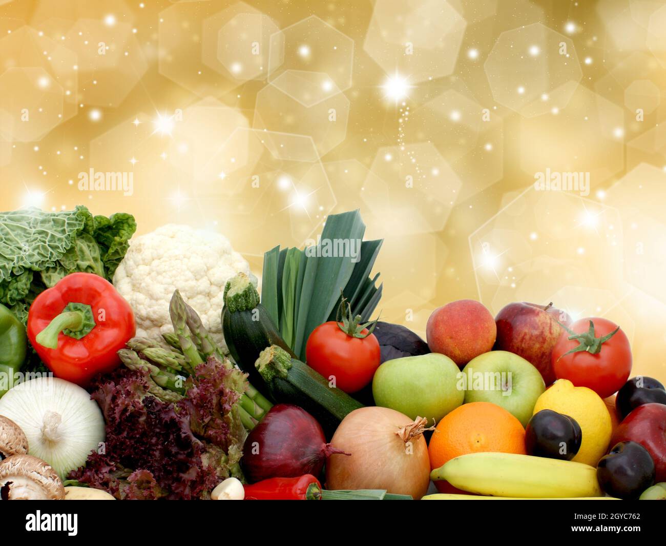 Fruit and vegetables on a glittery gold background Stock Photo - Alamy