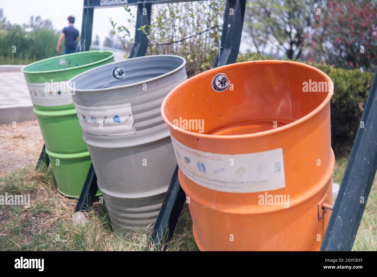 Three colorful trash cans in park from Mexico City Stock Photo - Alamy