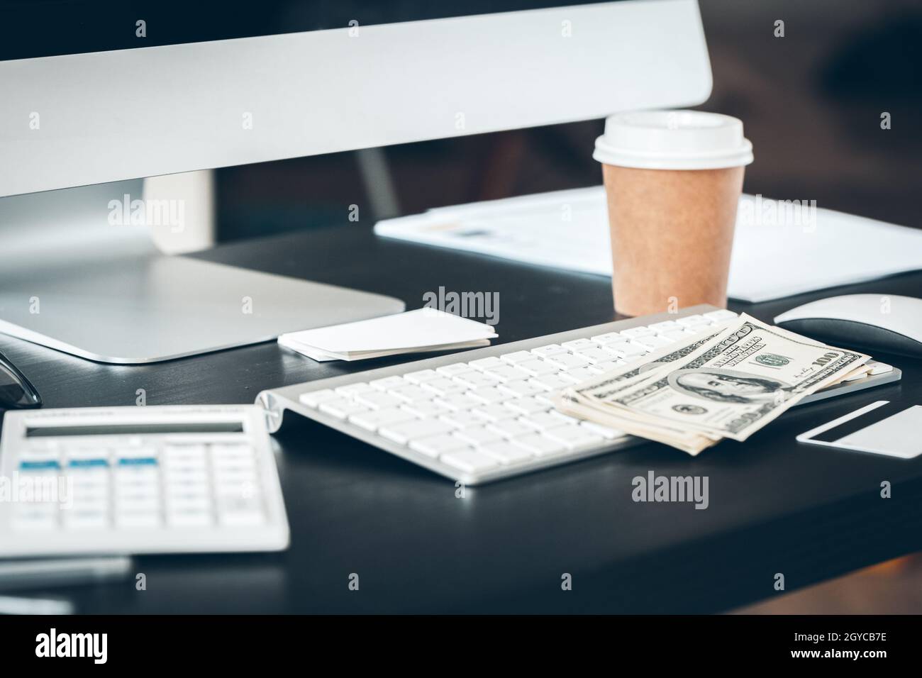 US dollar banknotes put on a computer keyboard close up Stock Photo - Alamy