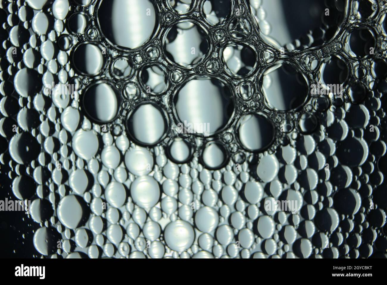 Abstract background of oil bubbles floating over water surface Stock ...