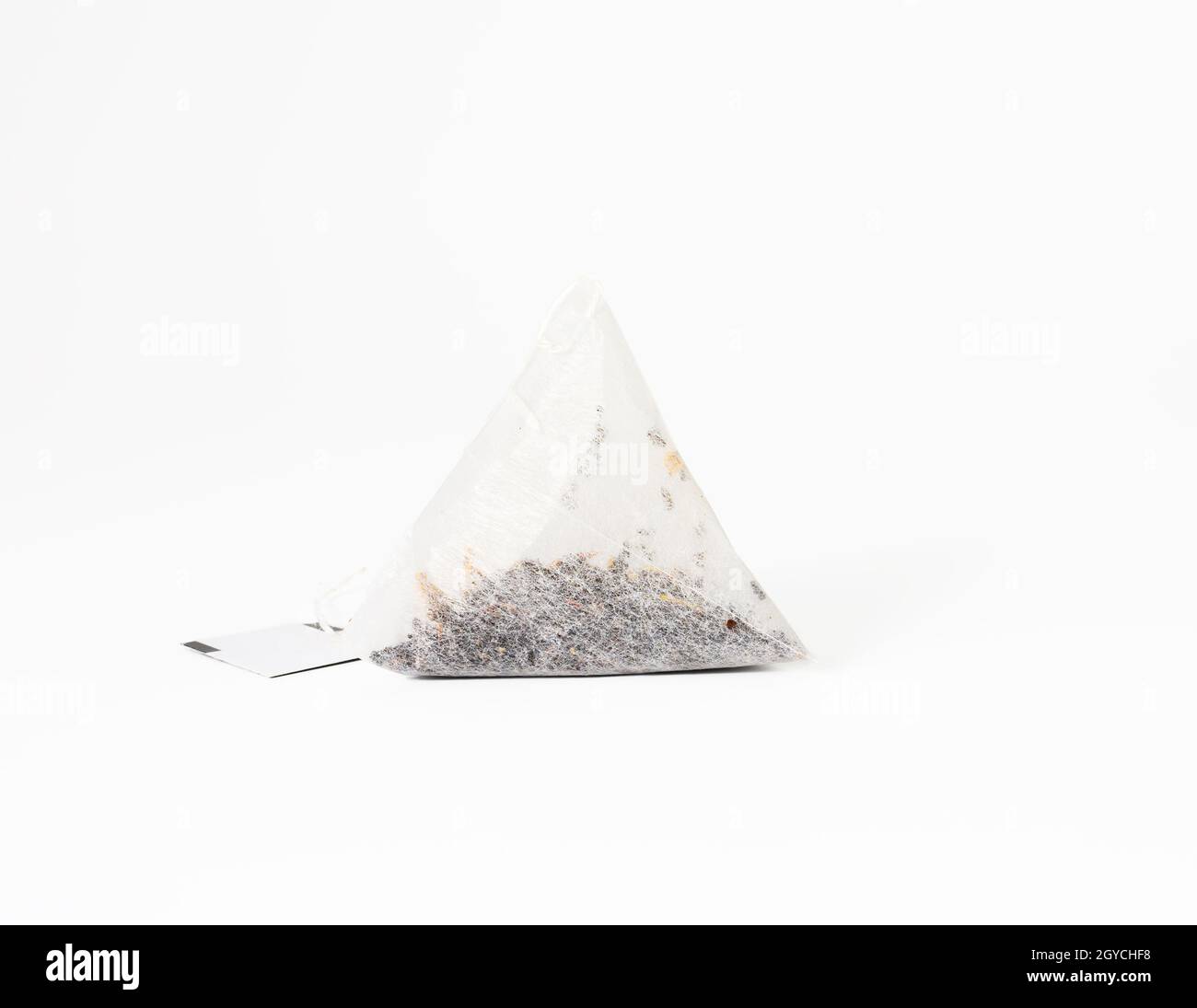 triangular disposable tea bag on a rope, white background Stock Photo ...