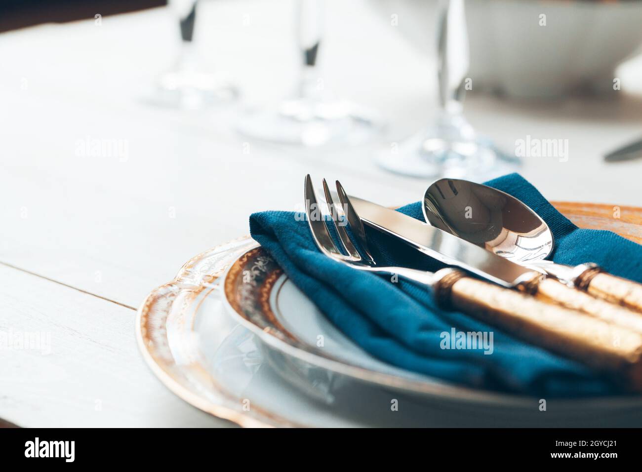 Close up shot of table setting for fine dining with cutlery and ...