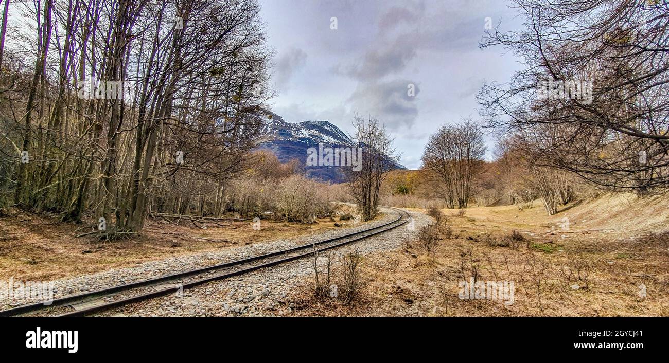 Horizontal shot of a railroad crossing the alley on mountains ...