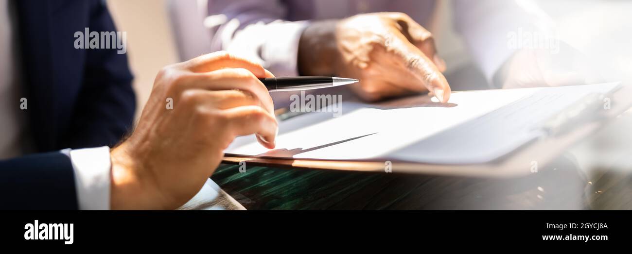 African hand signing legal document hi-res stock photography and images ...