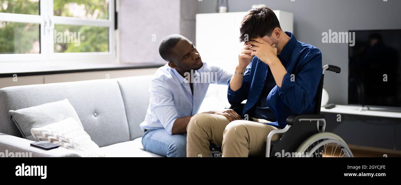 Unhappy Disabled Sad Man In Wheelchair Support Stock Photo - Alamy