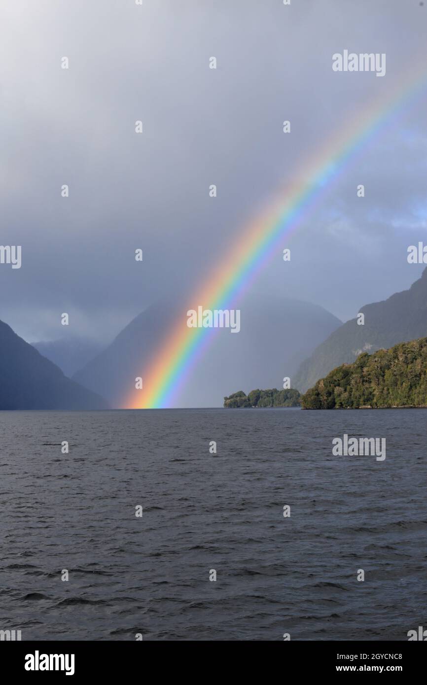 Spectacular rainbow in Fiordland New Zealand Stock Photo - Alamy