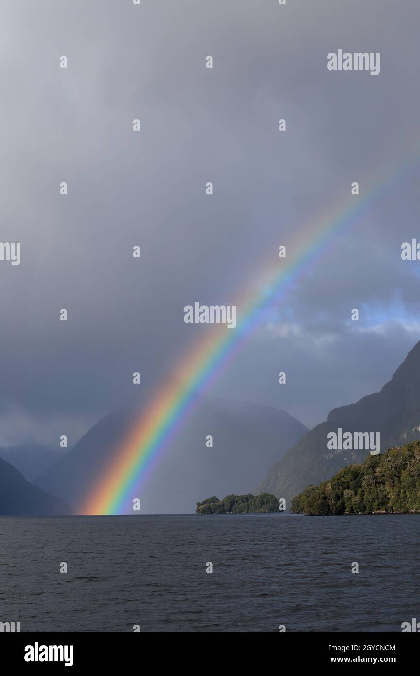 Spectacular rainbow in Fiordland New Zealand Stock Photo - Alamy