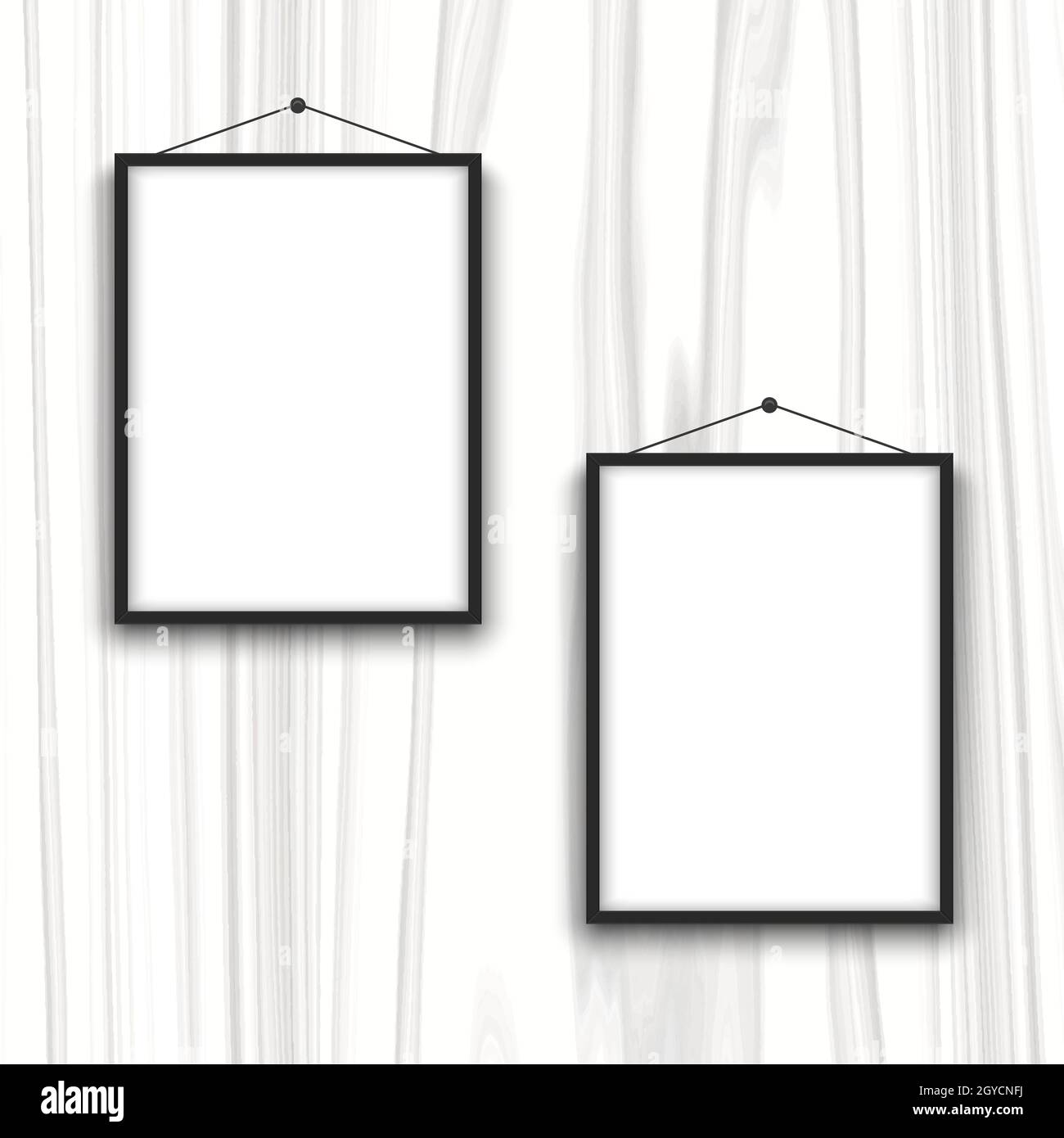 Two blank frames hanging on a wooden background Stock Photo - Alamy
