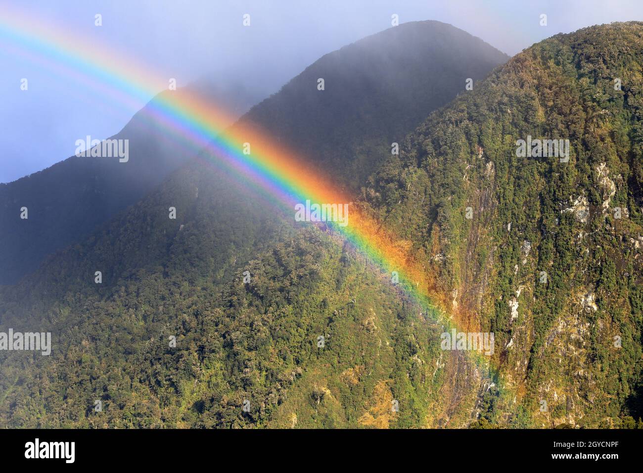 Spectacular rainbow in Fiordland New Zealand Stock Photo - Alamy
