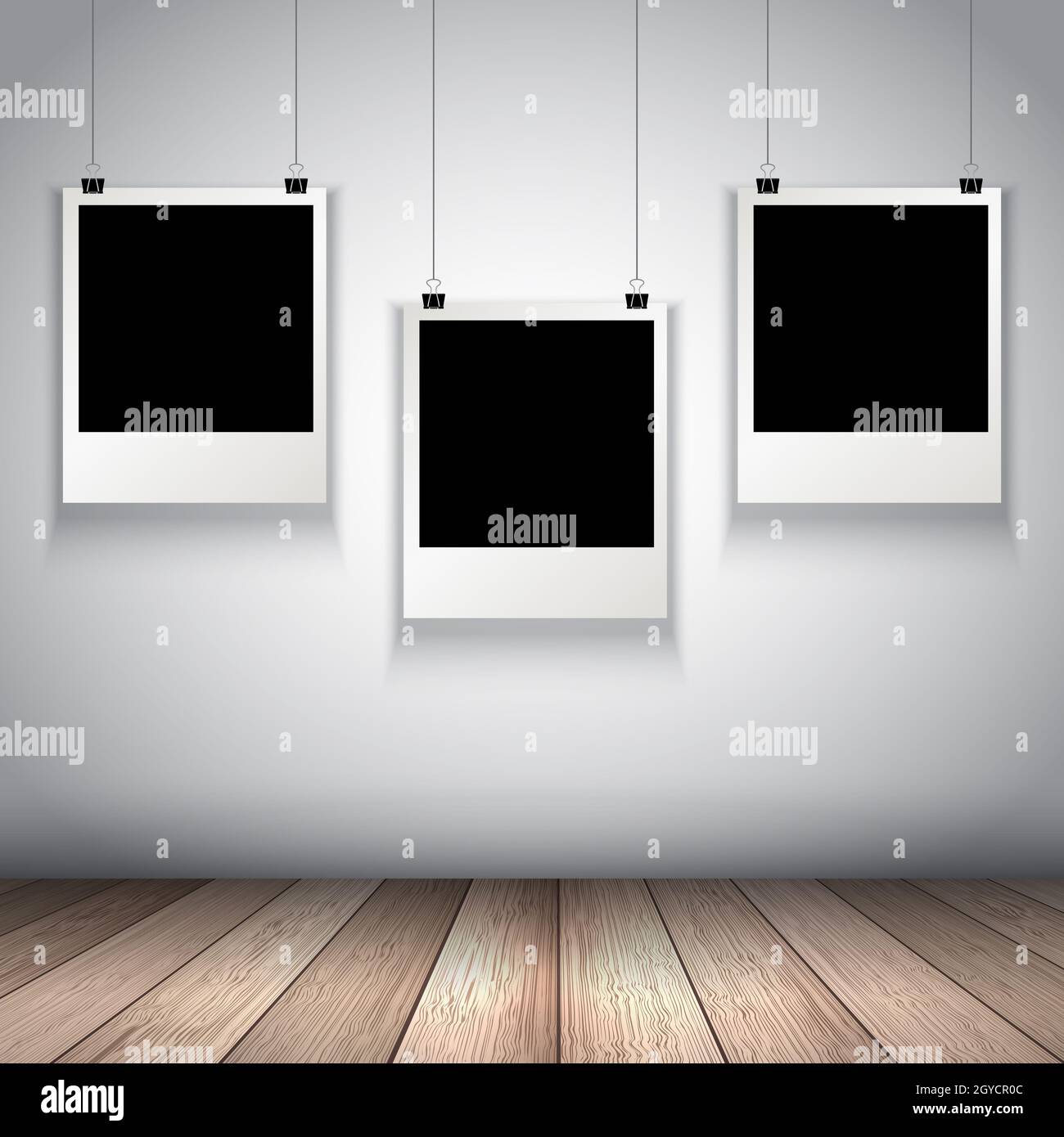 Collection of hanging blank photos Stock Photo - Alamy