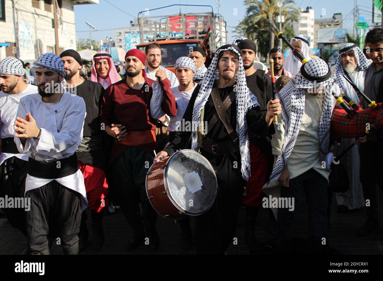 Gaza. 7th Oct, 2021. Palestinians participate in an event simulating a ...
