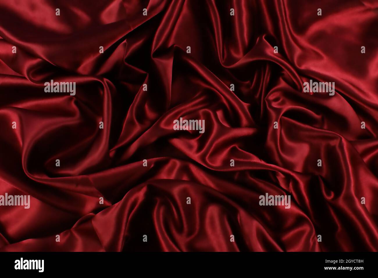 Luxury background of folded red silk Stock Photo - Alamy