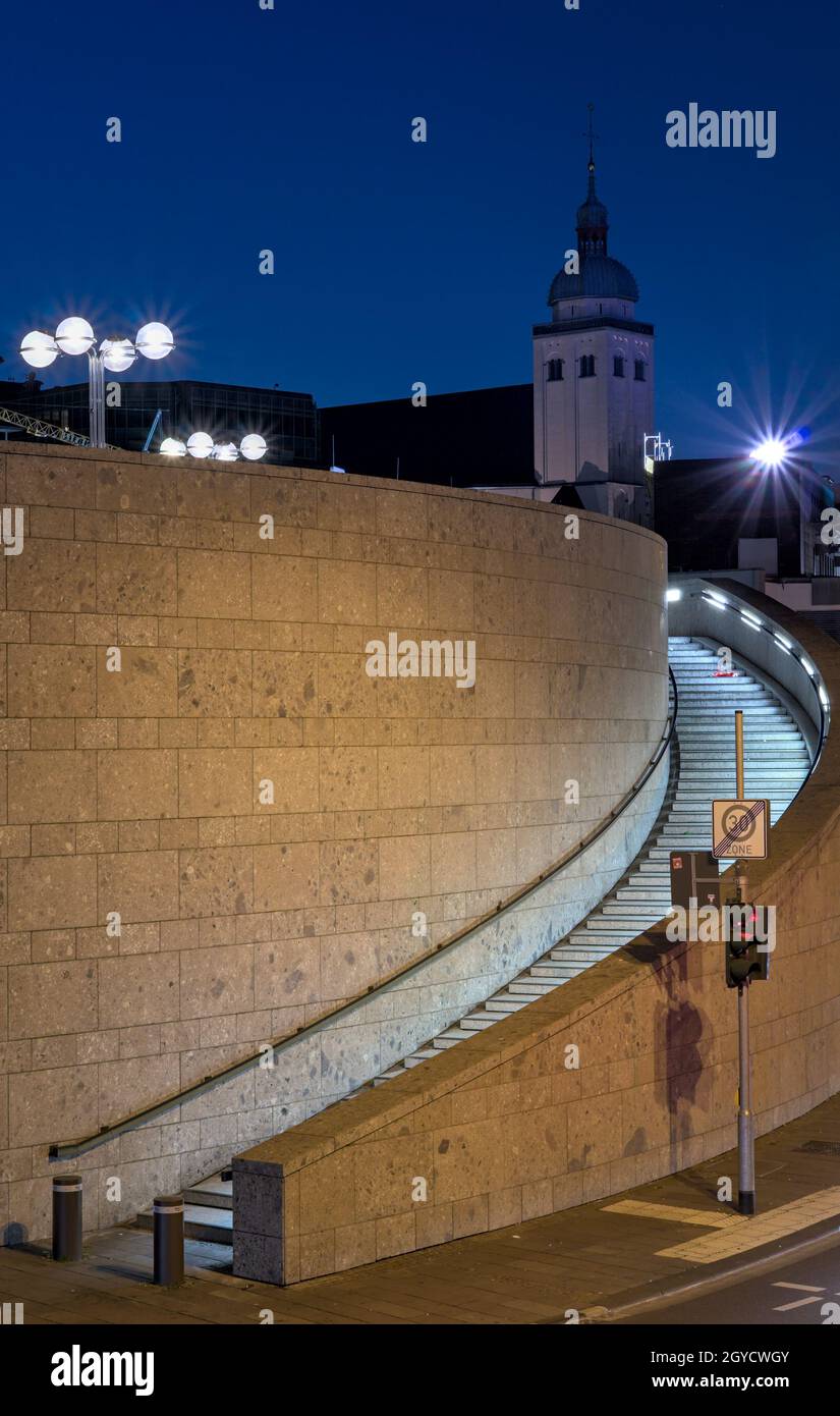 Vertical shot of stairs in the streets of Cologne, Germany at night ...