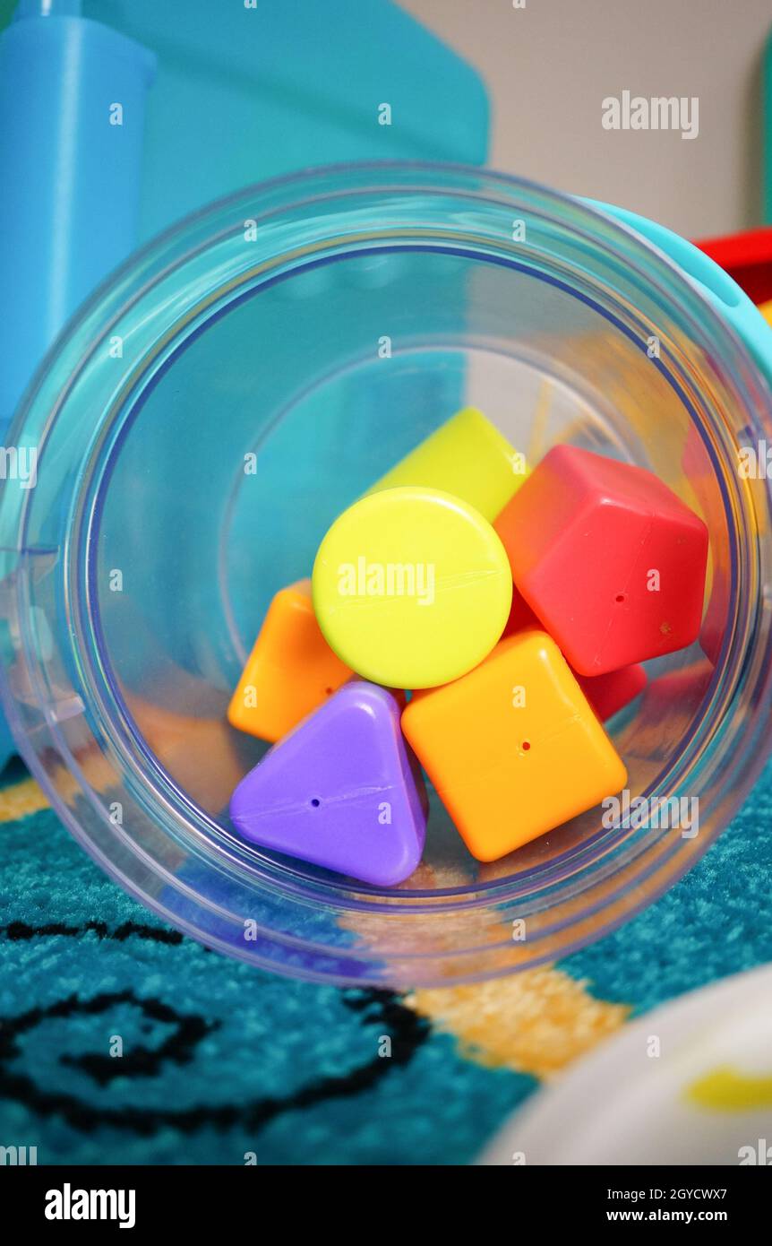 Vertical shot of plastic geometric shapes in a container Stock Photo ...