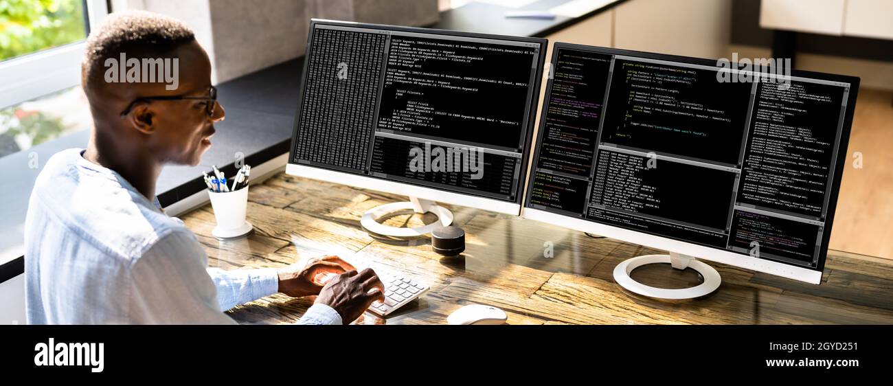 African American Coder Using Computer At Desk. Web Developer Stock ...