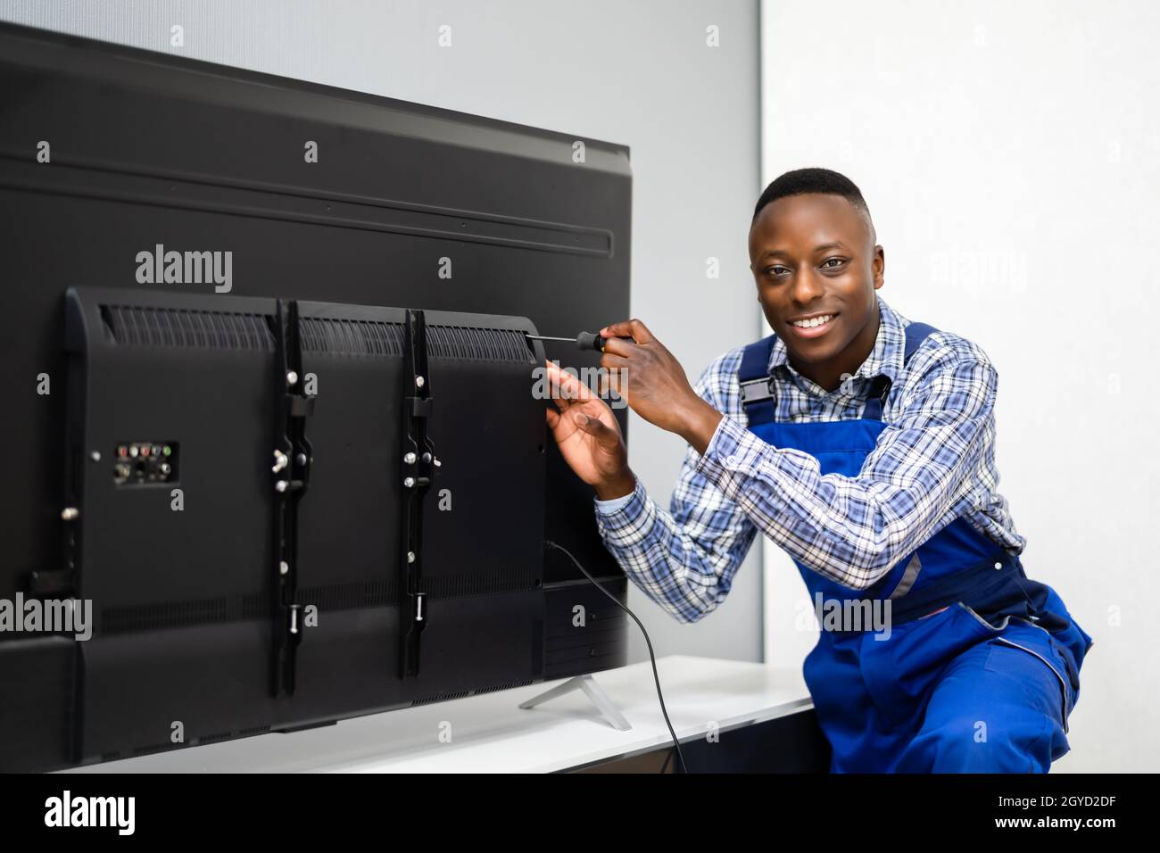Fixing LCD Television. TV Checking And Installation Stock Photo - Alamy