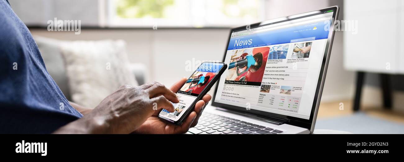 Newspaper phone laptop hi-res stock photography and images - Alamy