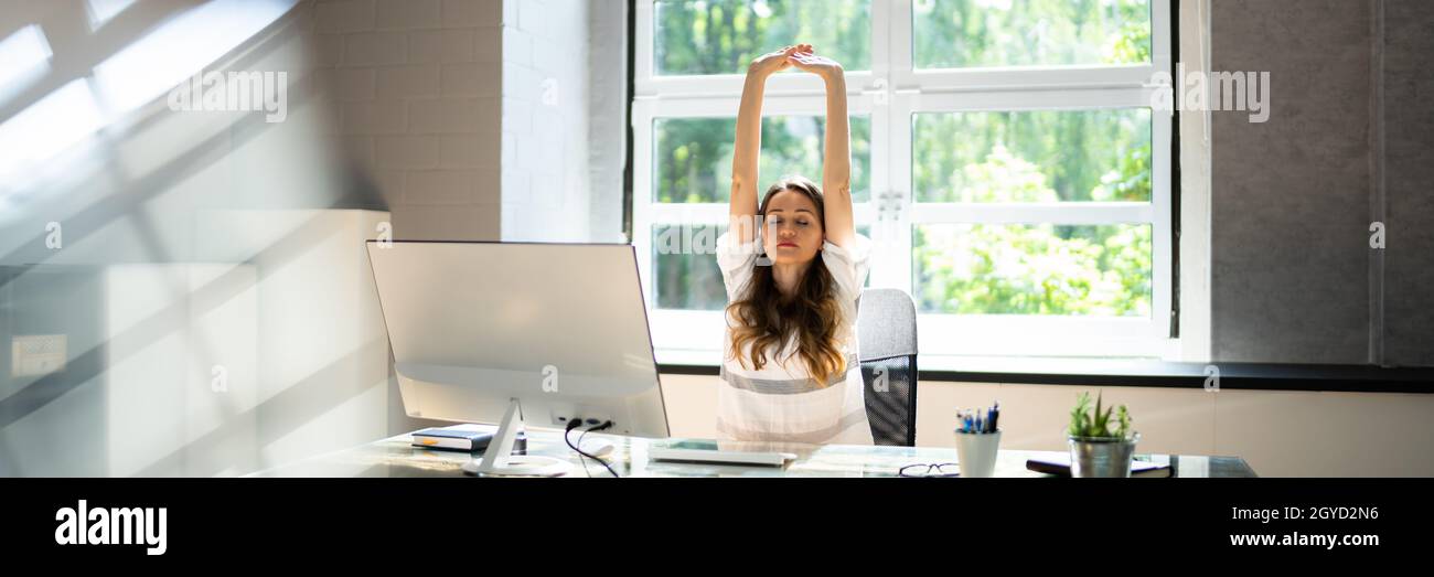 Stretch Workout Exercise At Desk Office. Woman At Break Stock Photo - Alamy