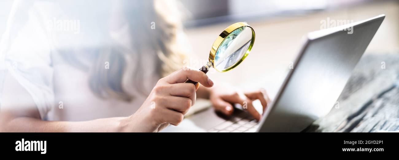 Searching Online Content On Laptop Computer Using Magnifying Glass ...