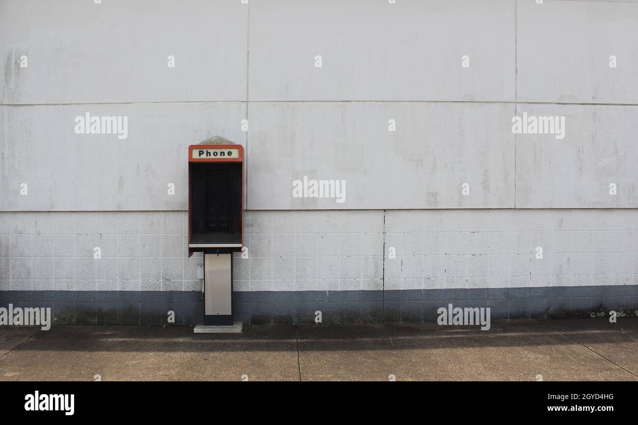 Broken Phone Booth on Wall of Abandoned Building Stock Photo - Alamy