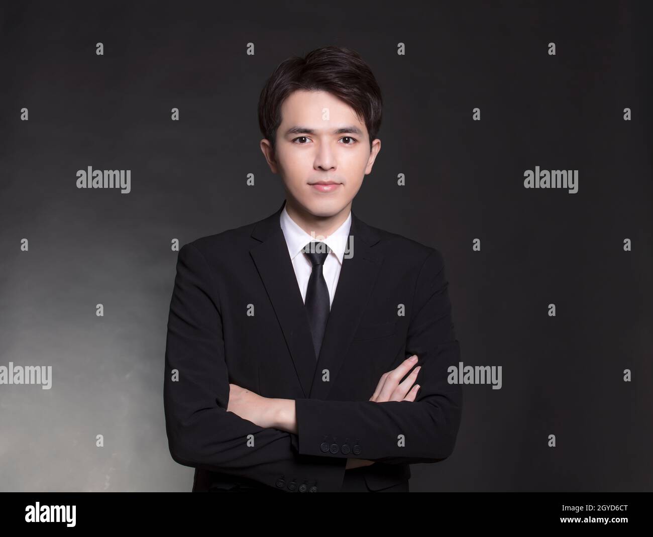Asian handsome Business man in black suit Stock Photo - Alamy