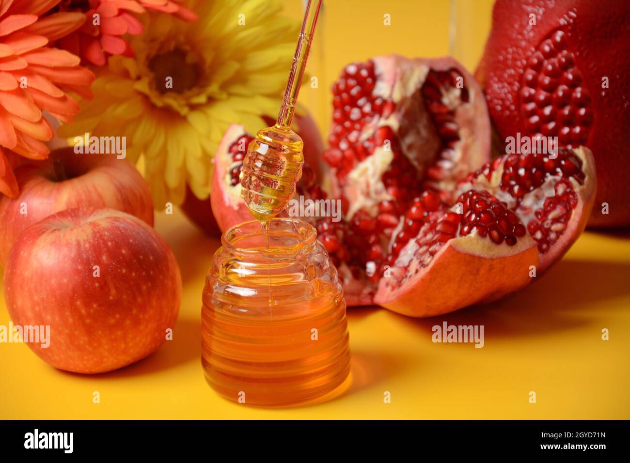 Rosh hashanah (jewish New Year holiday) concept. Traditional symbols-Honey jar, apples and ...
