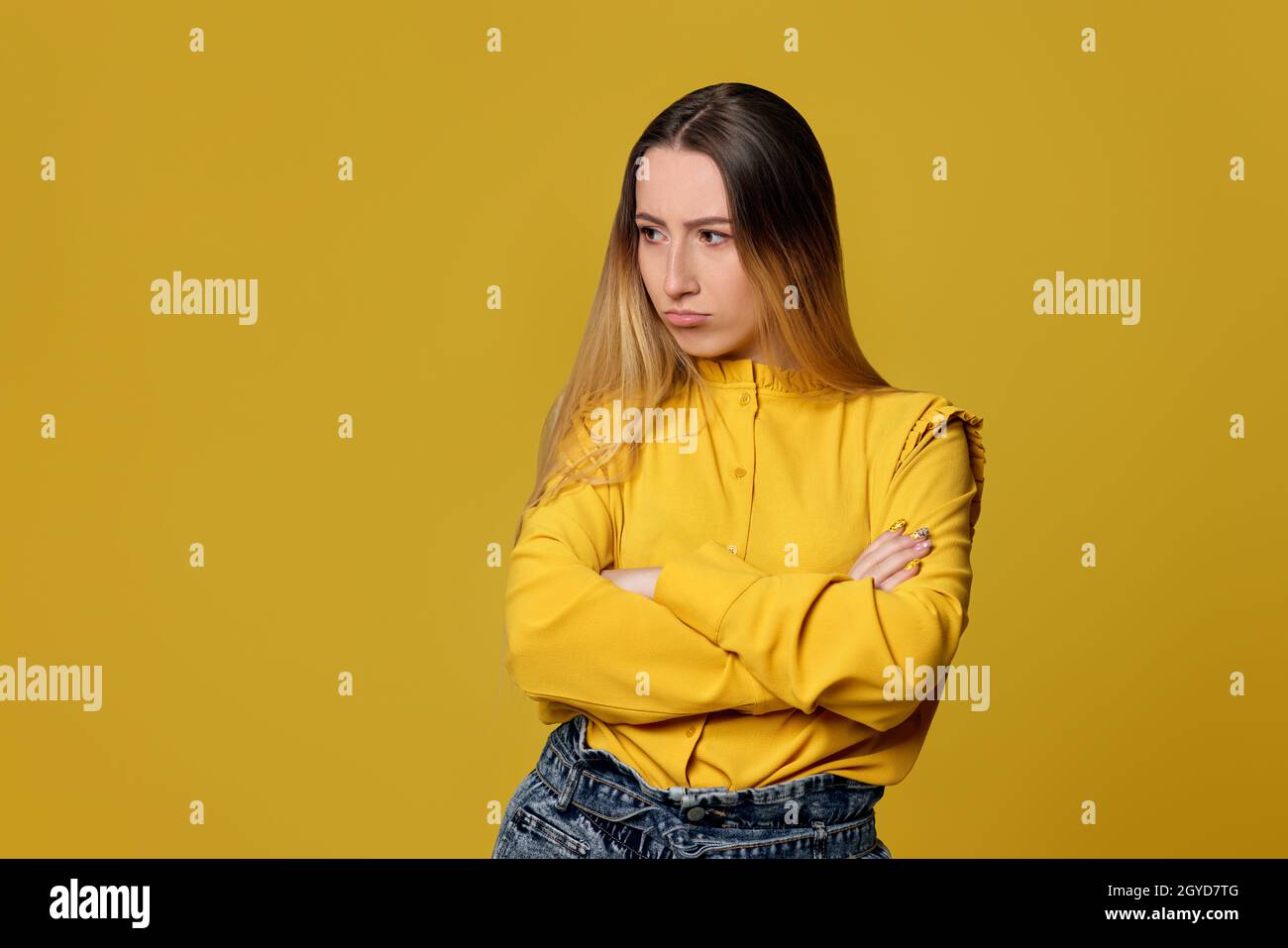 upset unsatisfied woman on yellow background. Human emotions, facial ...