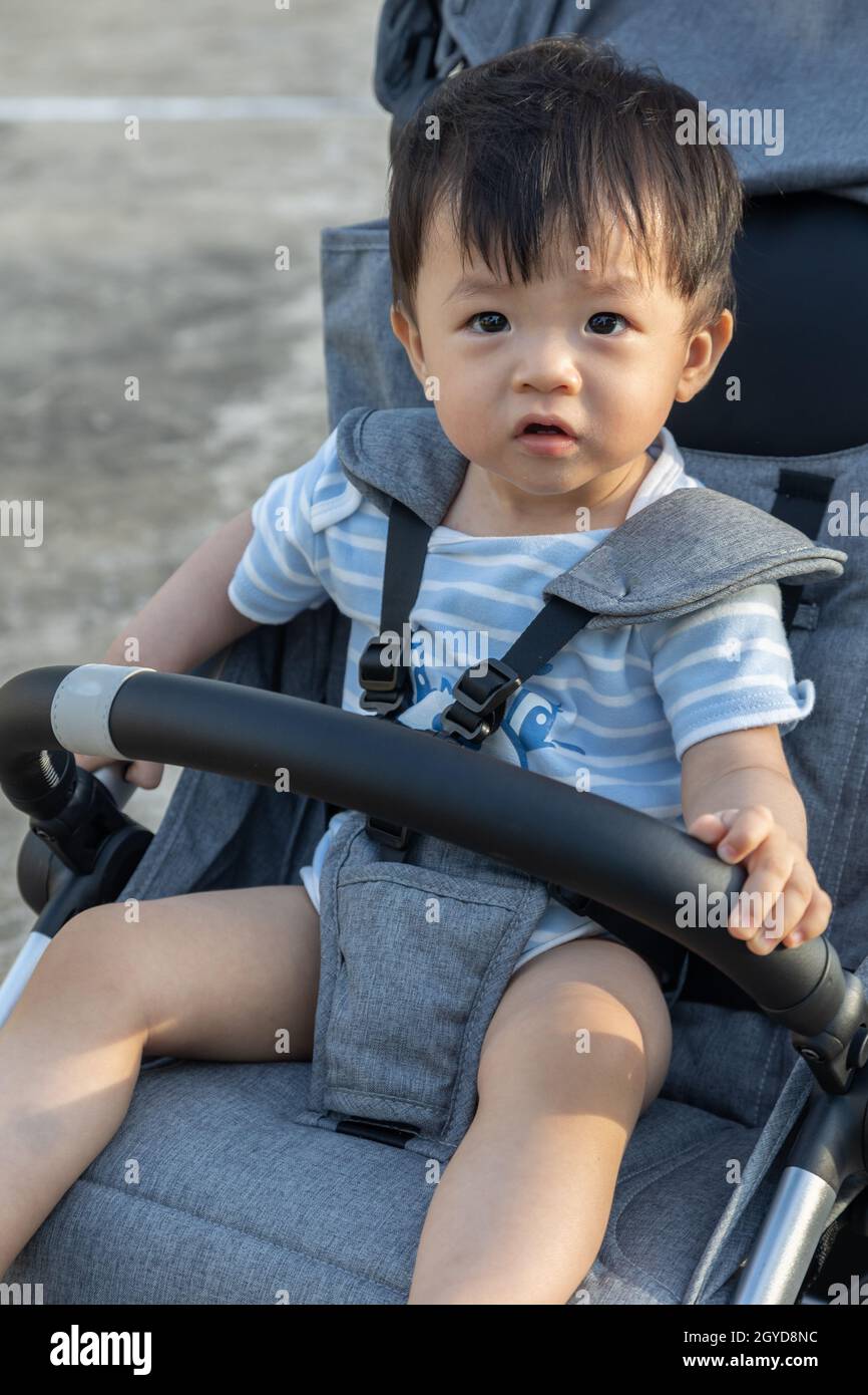 portrait image of Happy and cute Asian Chinese baby boy sitting on ...