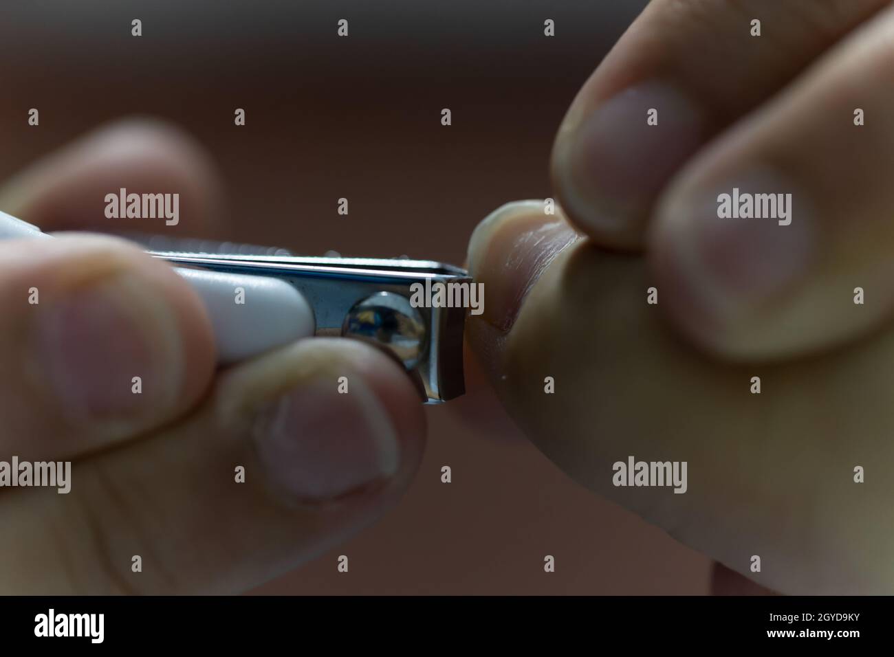 Woman clipping fingernails hi-res stock photography and images - Alamy