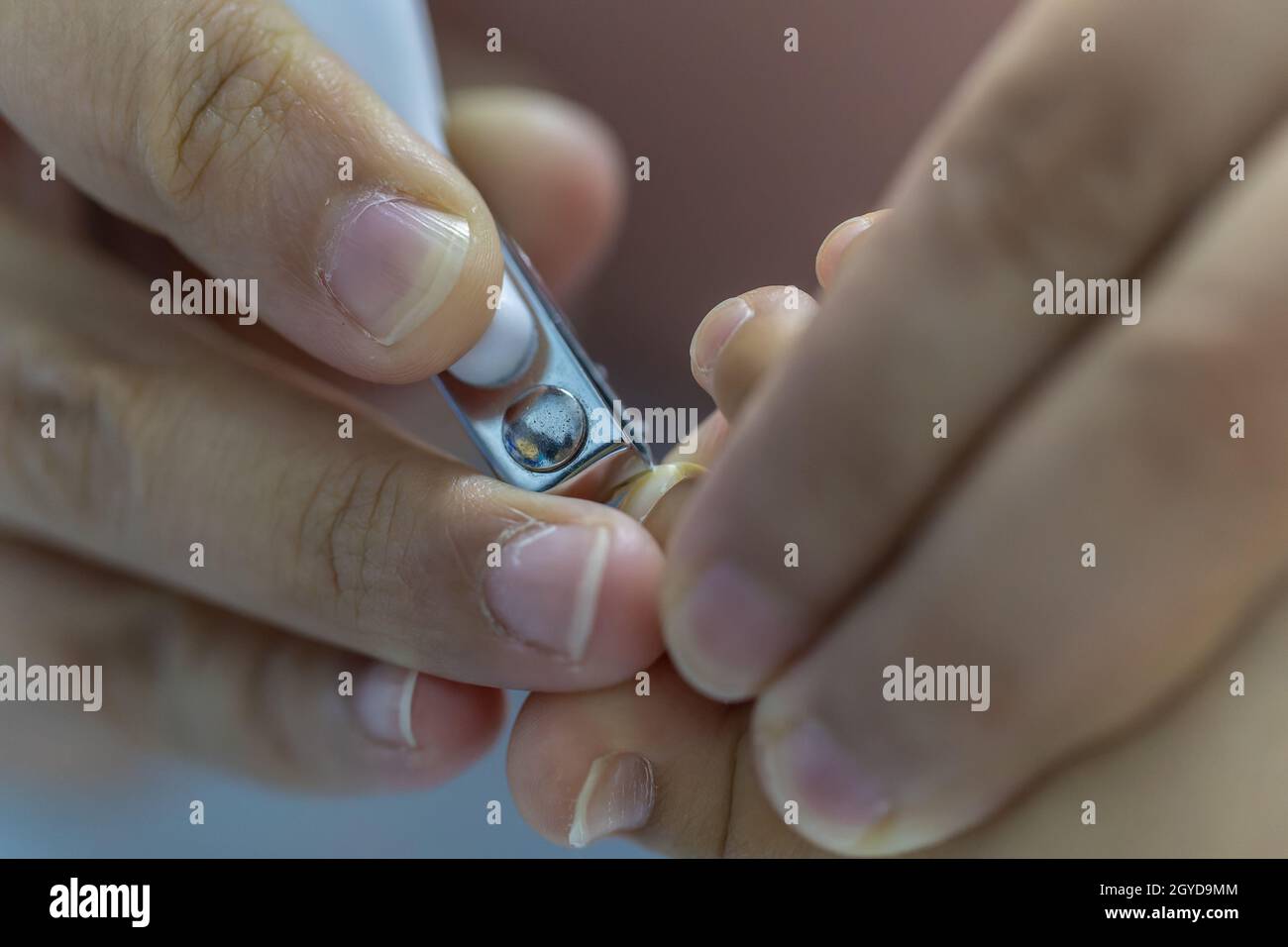 Woman clipping fingernails hi-res stock photography and images - Alamy