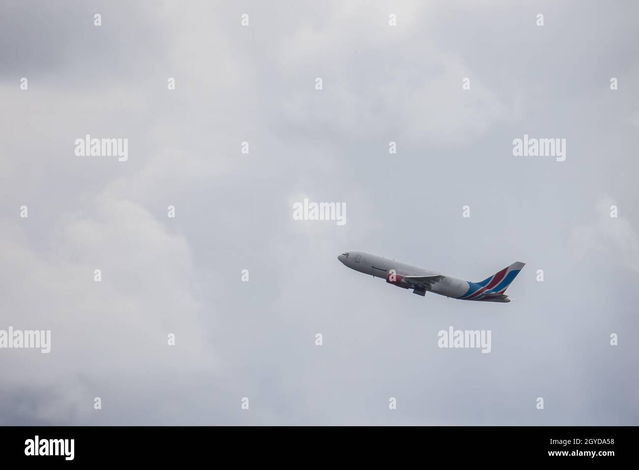 commercial Aircraft taking off flying in the air Stock Photo - Alamy