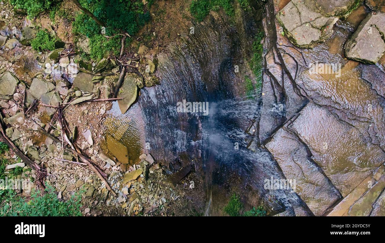 View looking down at edge of waterfall into gorge Stock Photo - Alamy