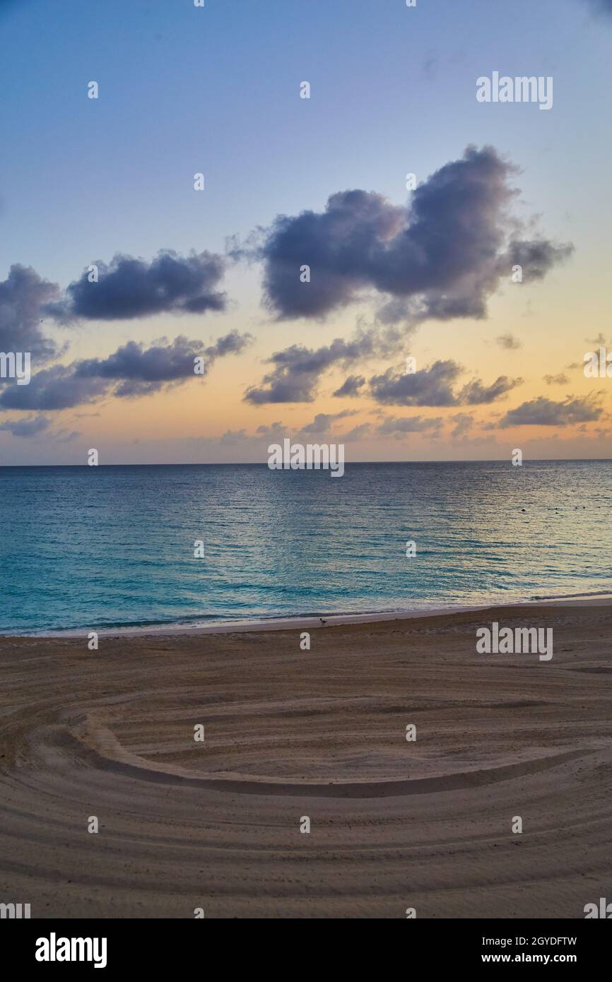 Clean sandy beach and blue ocean with soft sky during sunset Stock ...