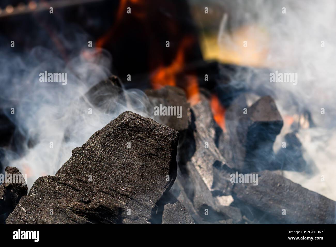 Barbecue grill pit with glowing and flaming hot open fire with red ...