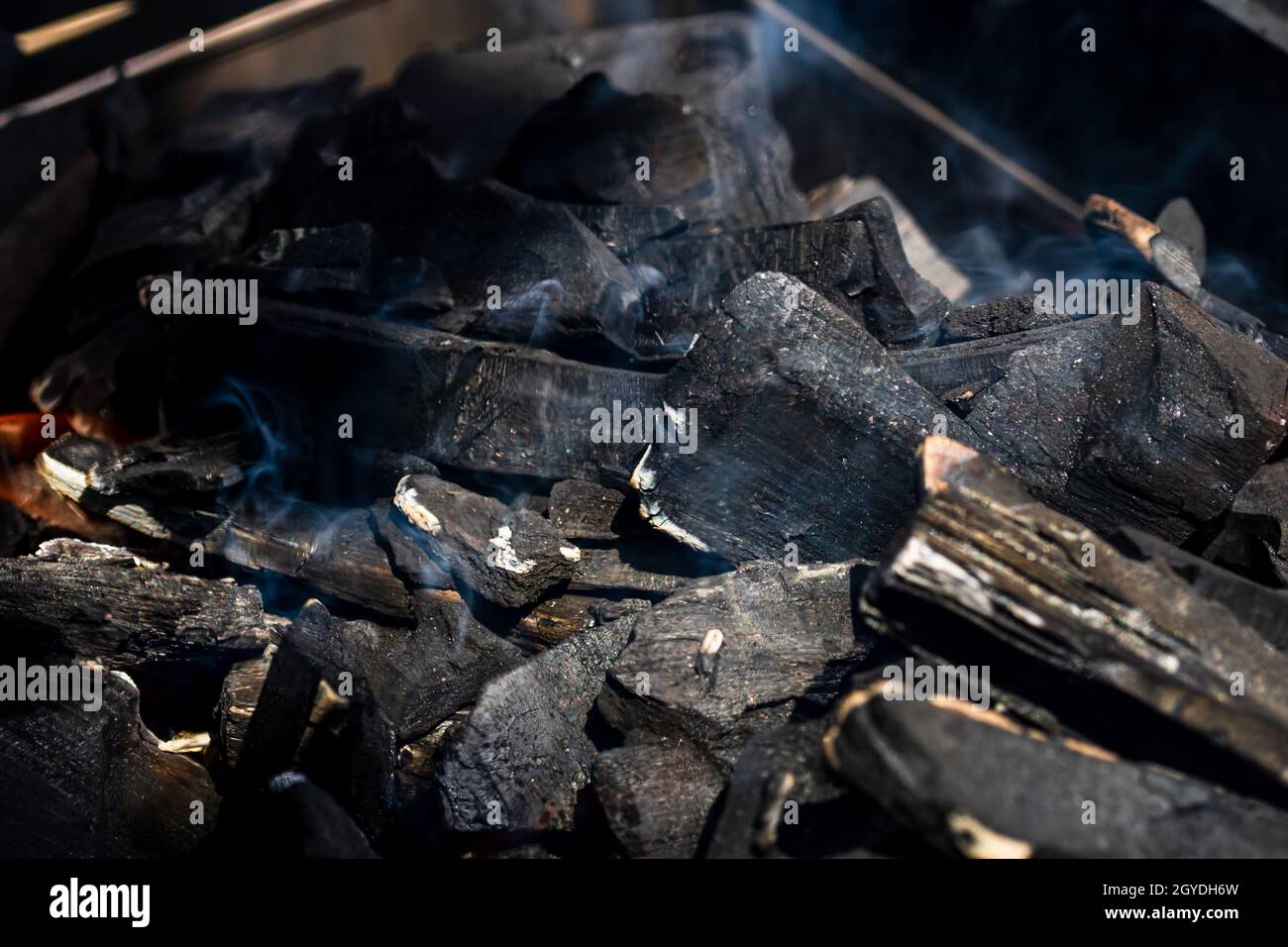 Barbecue grill pit with glowing and flaming hot open fire with red ...