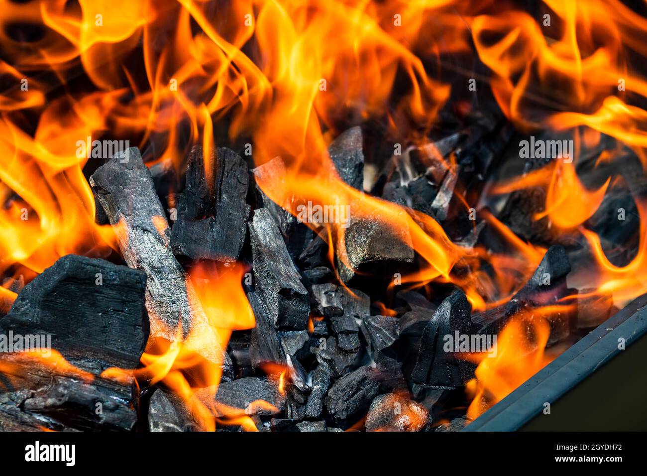 Barbecue grill pit with glowing and flaming hot open fire with red ...