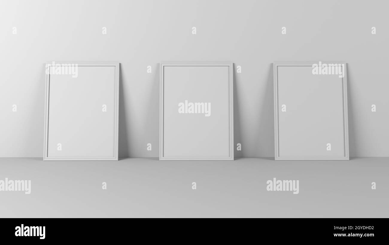 Render of 3D Blank Picture Frames on Empty Wall Stock Photo - Alamy