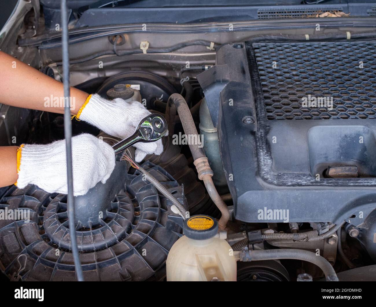 Mechanic holding a block wrench handle while fixing a car Stock Photo ...