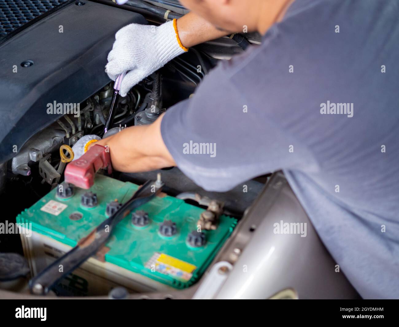 Mechanic holding a block wrench handle while fixing a car Stock Photo ...