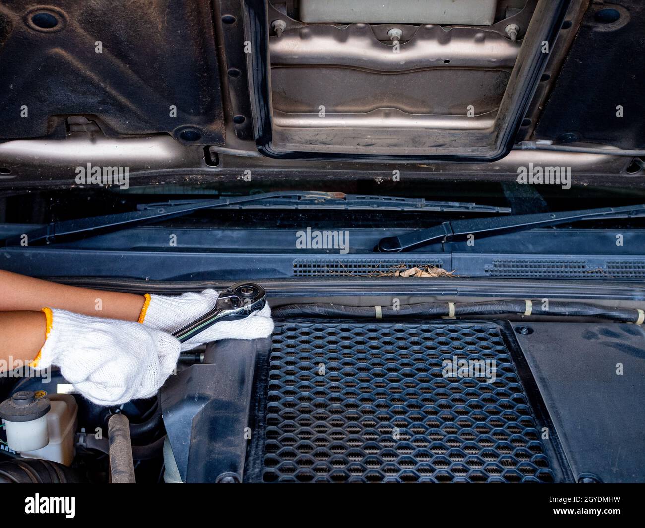 Mechanic holding a block wrench handle while fixing a car Stock Photo ...