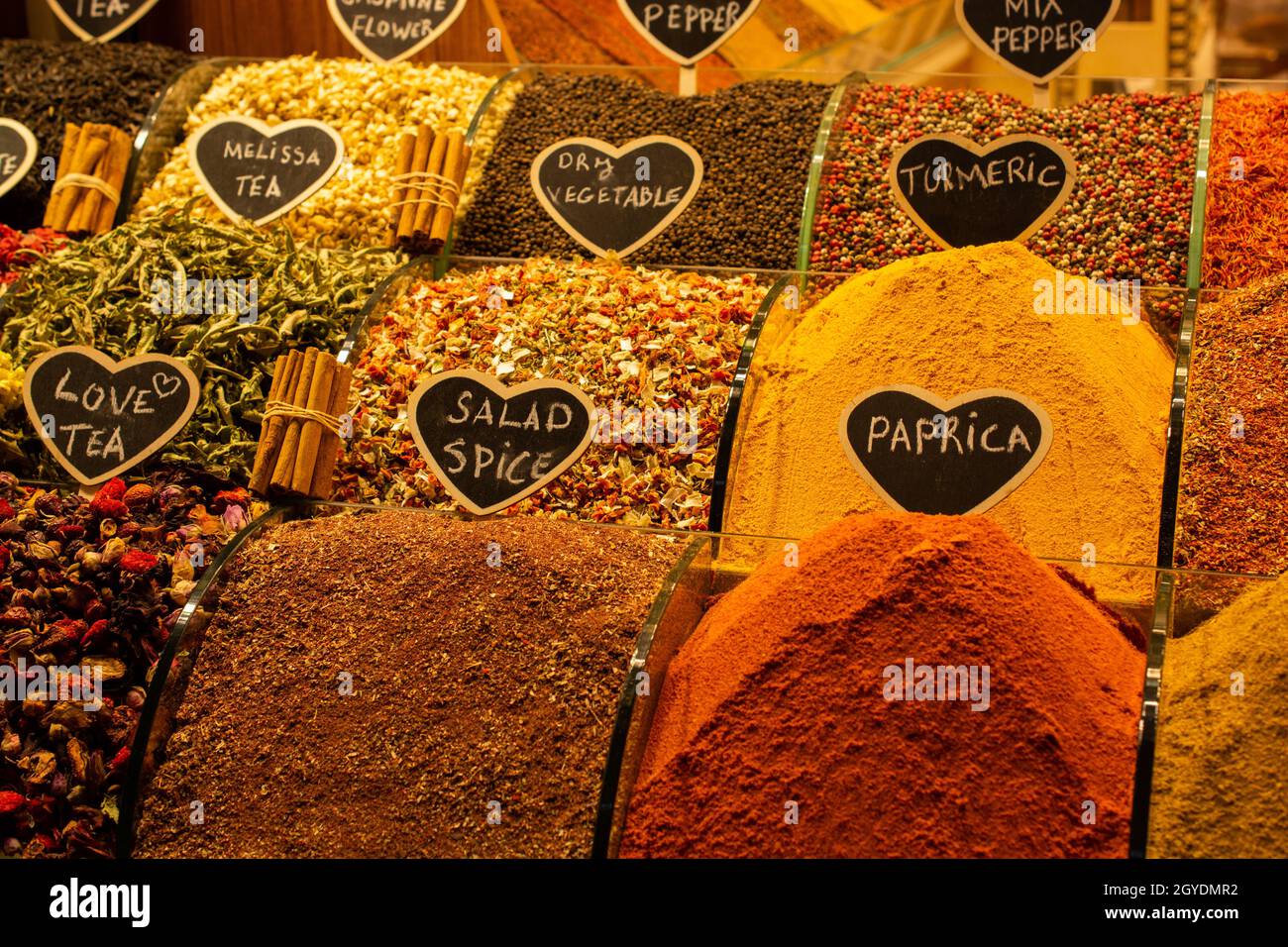Containers full of various oriental colorful spices in the market for ...