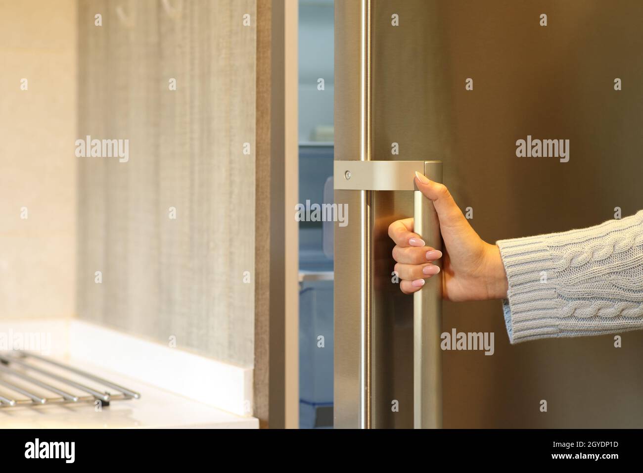 Hand opening refrigerator hi-res stock photography and images - Alamy