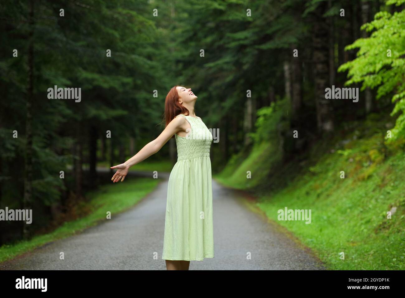 Happy woman smiling breathing fresh air in the mountain road Stock ...