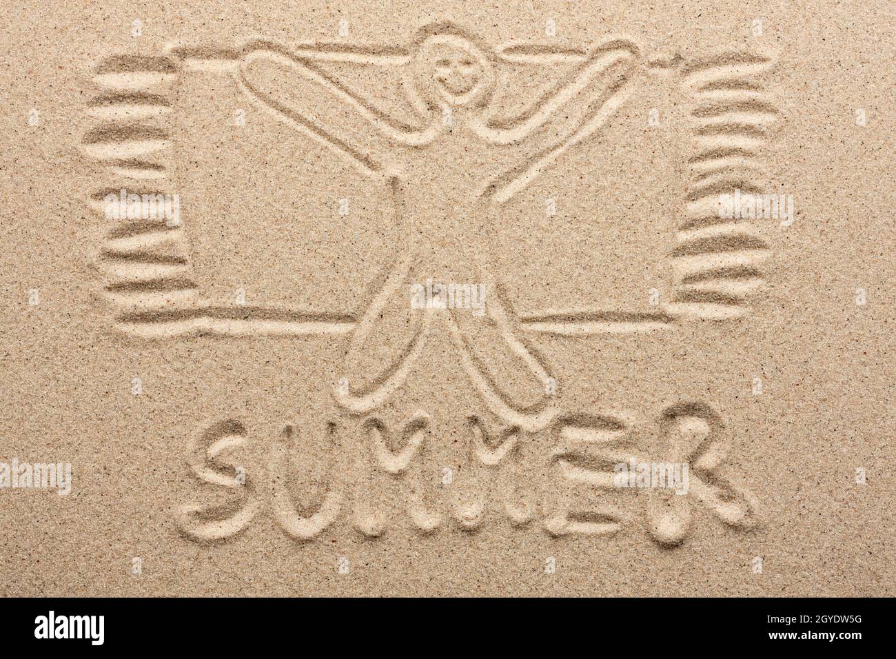 Drawn man on the sand, conceptual image Stock Photo - Alamy