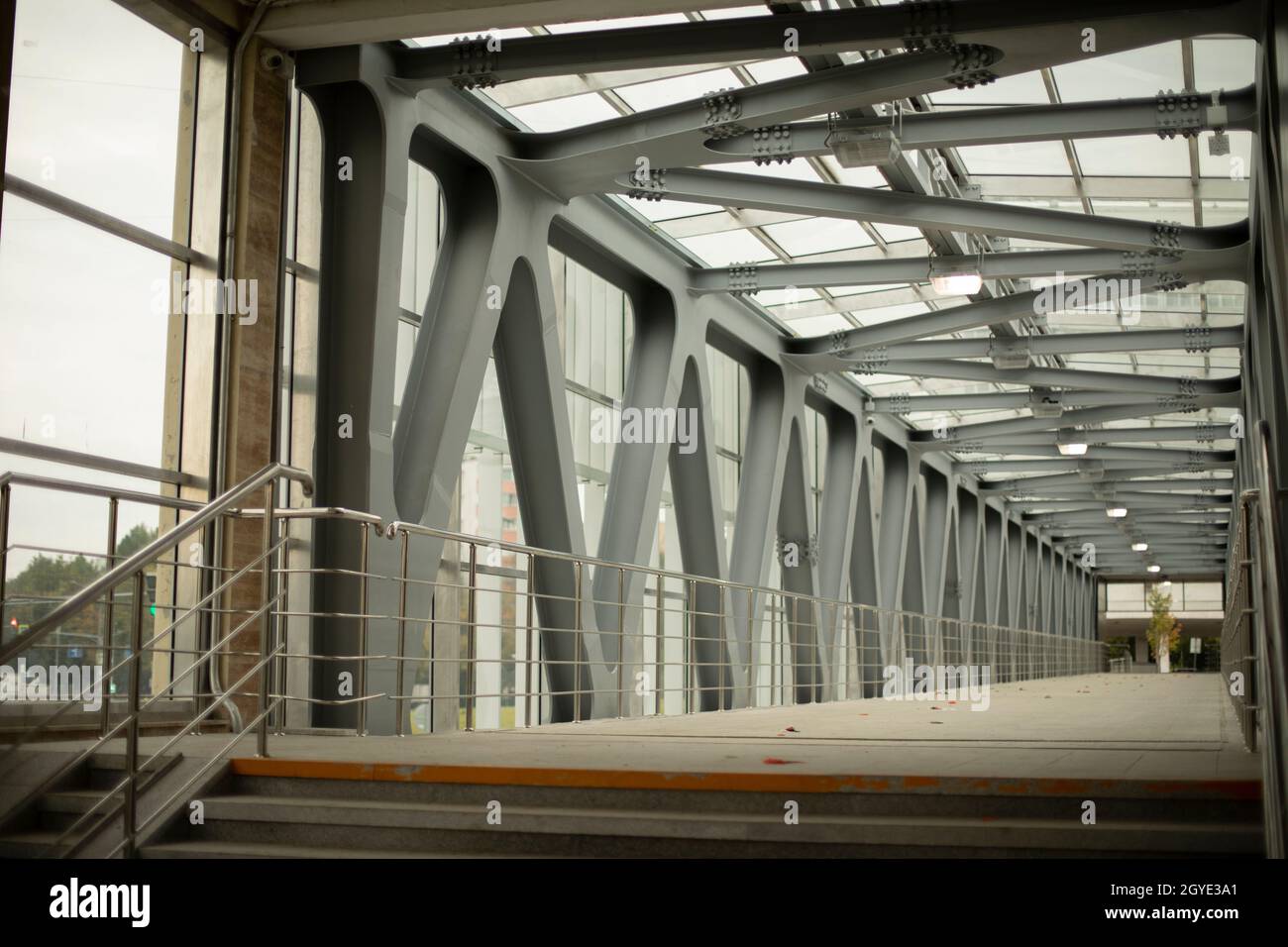 Architecture in the city. Pedestrian crossing over the highway. Steel ...