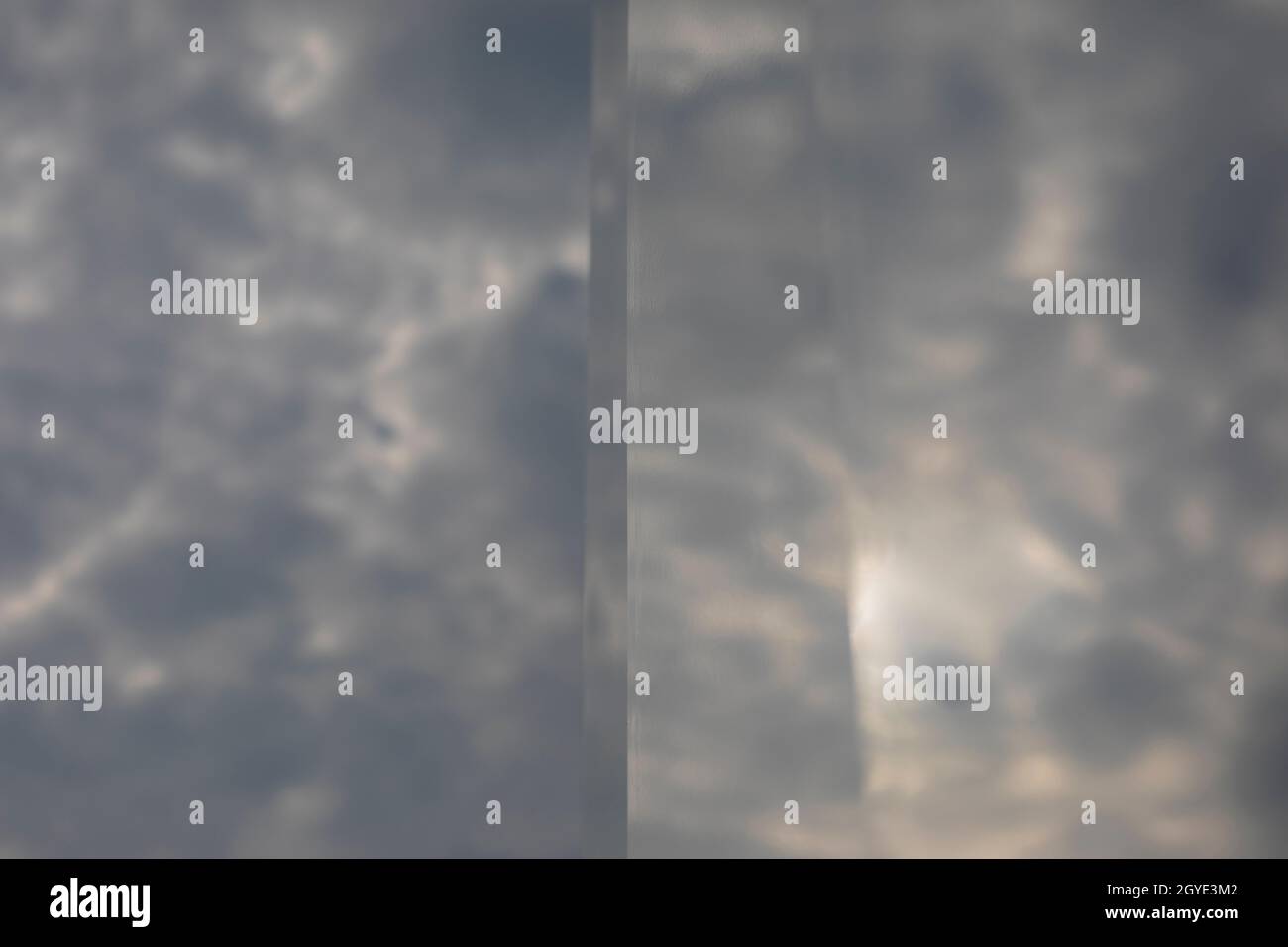 The texture of the sky reflected in the mirror. Clouds distorted by a ...