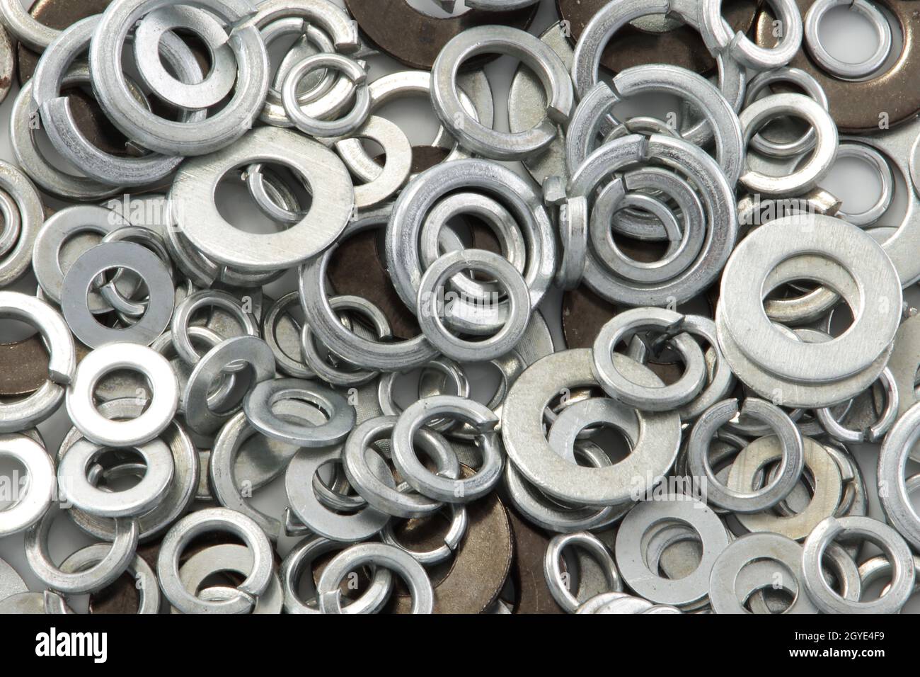 A pile of washers of different sizes background image Stock Photo - Alamy