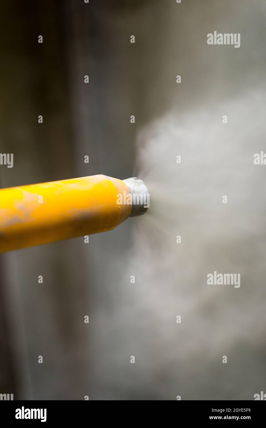 Vertical shot of the tip of the powder coating gun Stock Photo - Alamy